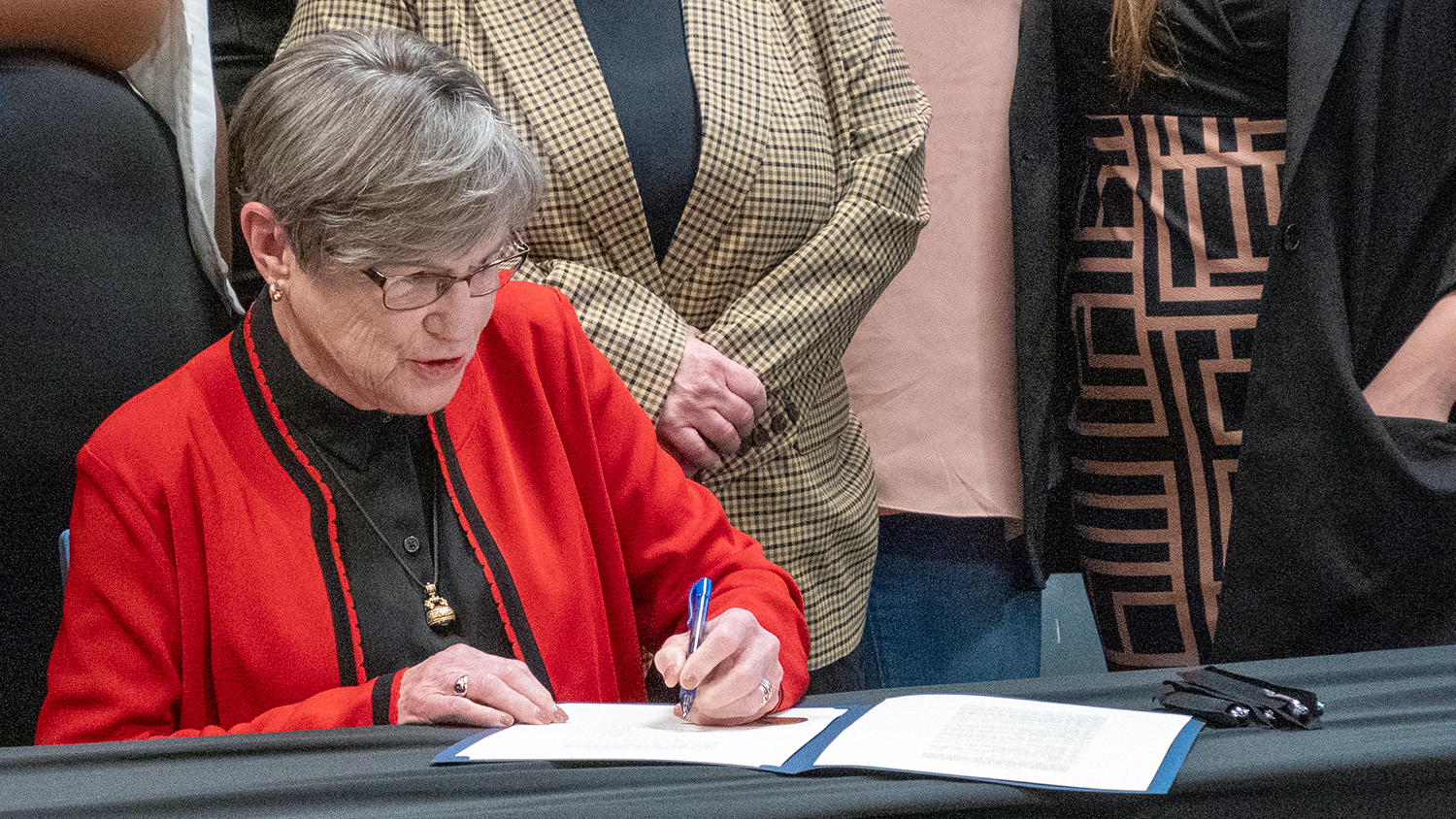 Kansas governor signs budget bill with dozens of line-item vetoes ...